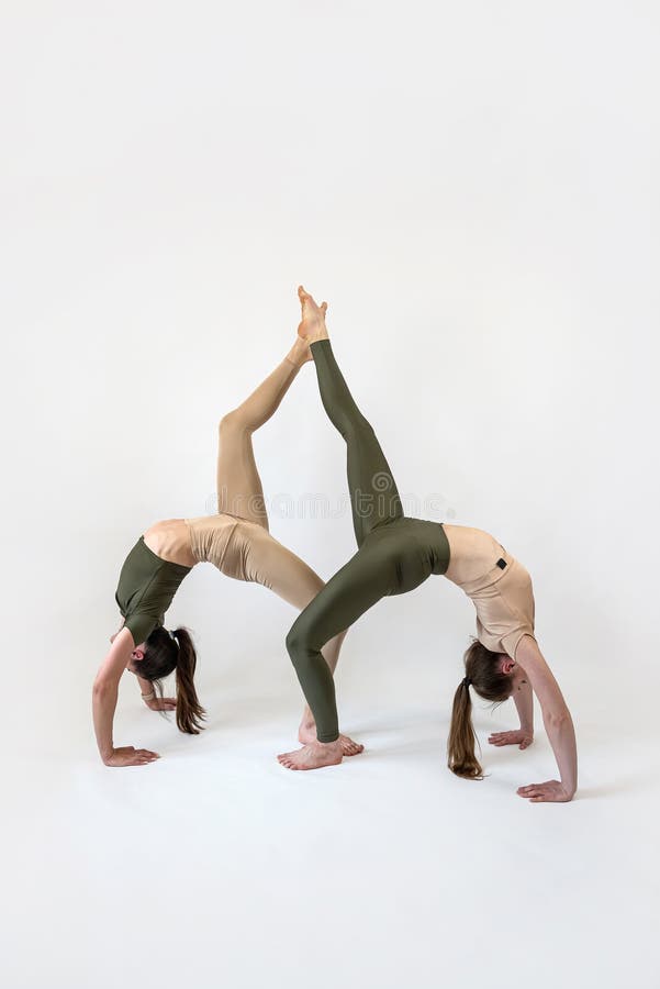 Two Female Instructors Show How To Properly Perform Yoga or Stretching ...