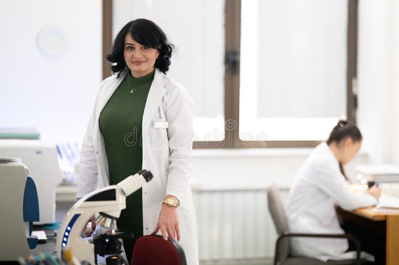 Two Female Lab Technicians Working in Laboratory Stock Photo - Image of ...
