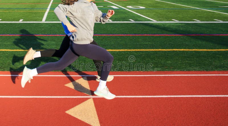 Two Female Runners Training on a Track Stock Image - Image of ...