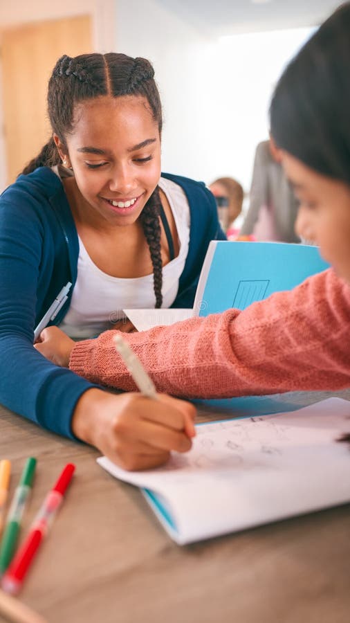 Two Female Secondary or High School Students Collaborating in Study ...
