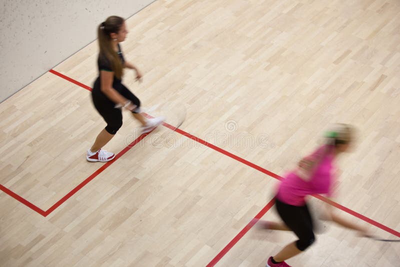 Two Female Squash Players in Fast Action on a Squash Court Stock Photo ...