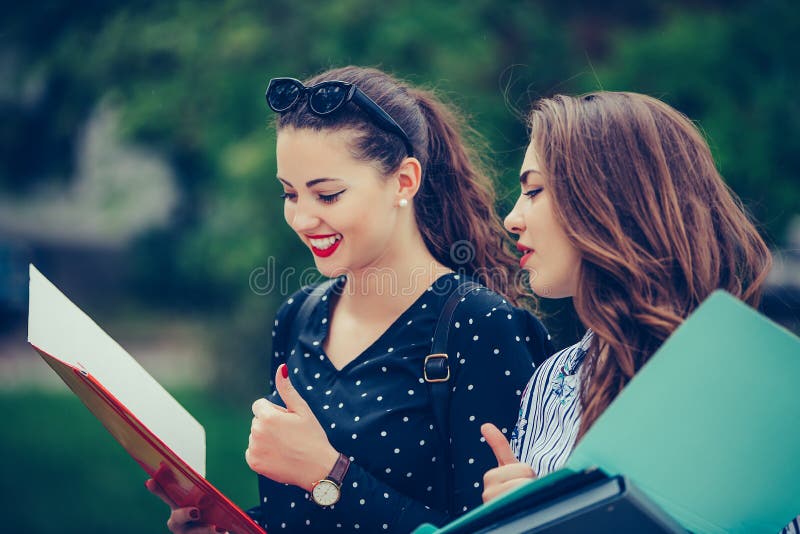 Two Female Students Checking Paper Notes before Exam Stock Photo ...