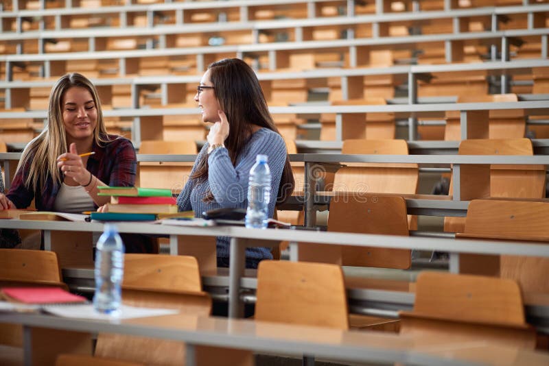 Two Female Students Talking and Having Fun Stock Photo - Image of ...