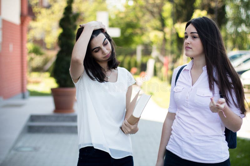 Two Female Students Talking about Their Struggles on the Campus Stock ...