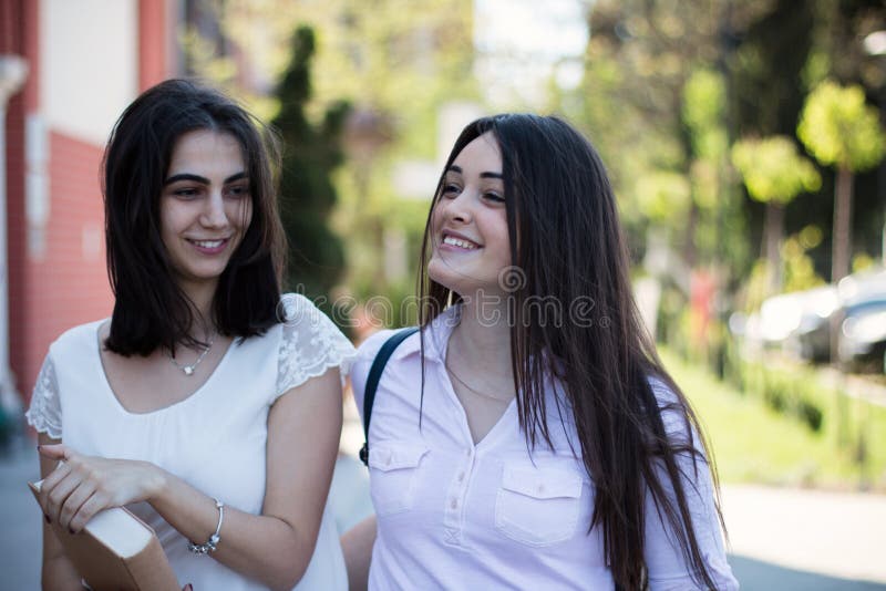 Two Female Students Walking Together on the Campus Stock Photo - Image ...