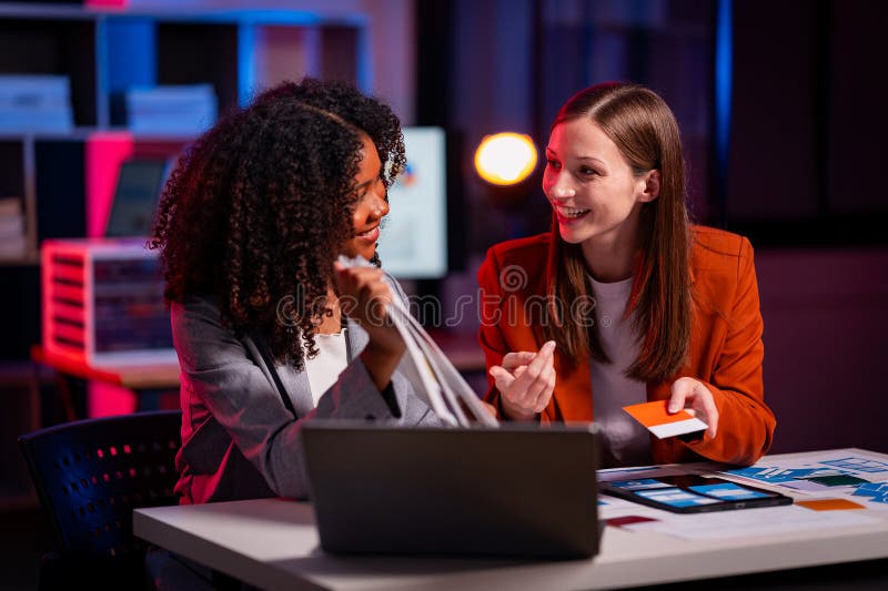 Two Female UI UX Designers Work Together To Talk about Designing Mobile ...