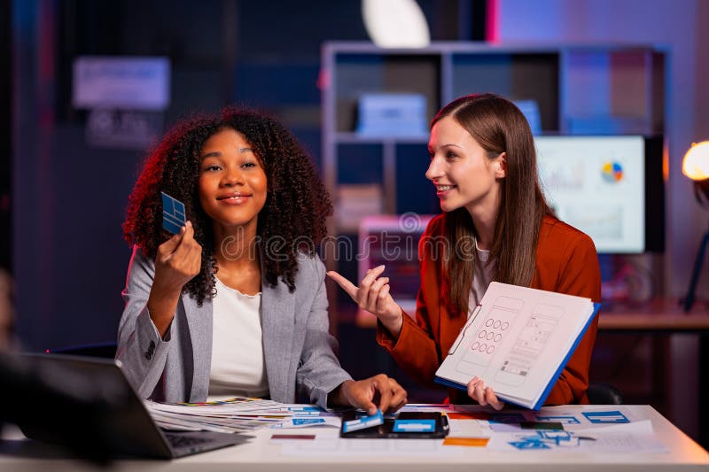 Two Female UI UX Designers Work Together To Talk about Designing Mobile ...