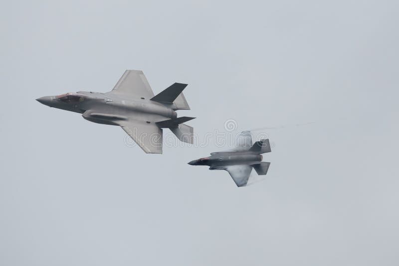 Two Fighter Jets Fly through the Sky on Technology Background Stock ...