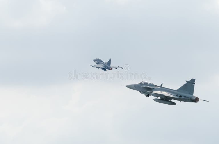 Two Fighter Jets Fly through the Sky on Technology Background Stock ...