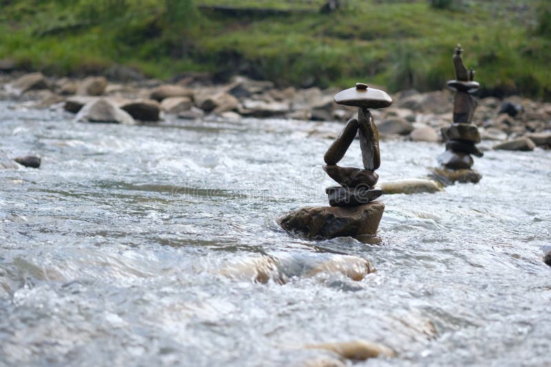 Two Figures Made of River Stones in the Middle of the Stream Stock ...