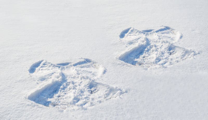 Two Figures in the Snow Angel Stock Image - Image of christmas, playful ...