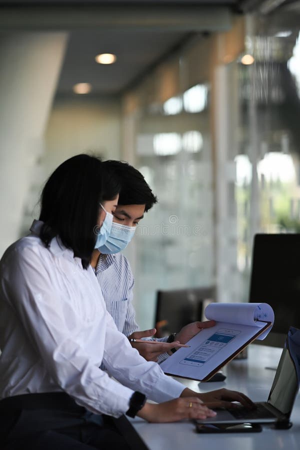 Two Financial Experts in Protective Mask and Discussing Information ...