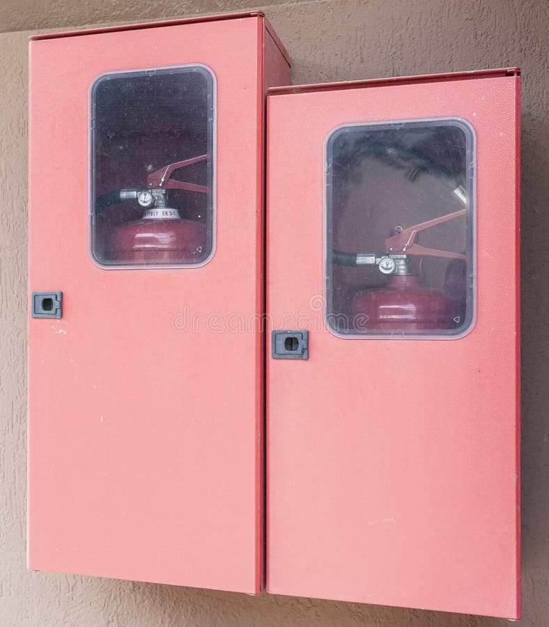 Two Fire Extinguishers in Their Lockers Stock Photo - Image of ...