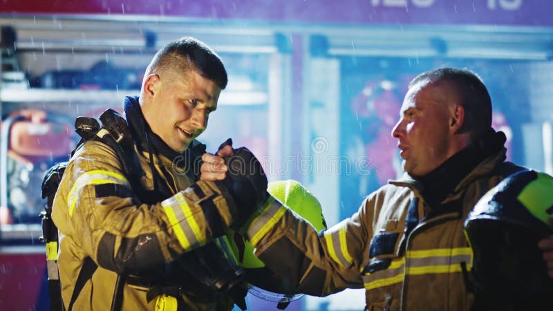 Two Firefighters Shaking Hands after Successfully Extinguished Fire ...