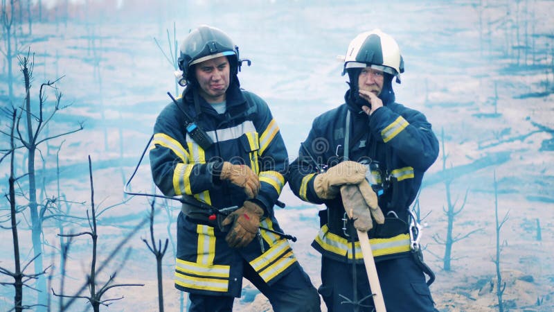 Two Firefighters Standing Together, Wearing Uniform and Protective ...