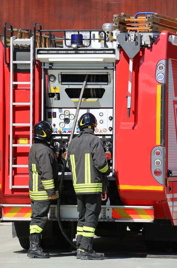 Two Firemen in Action during Fire Drill Stock Image - Image of ...