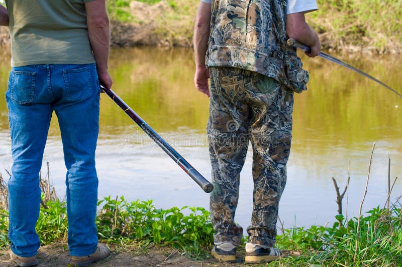 Two fishermen stock image. Image of river, fish, rods - 20098601