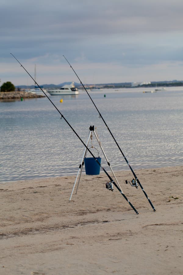 Two Fishing Rods at the Beach Stock Photo - Image of equipment, fish ...