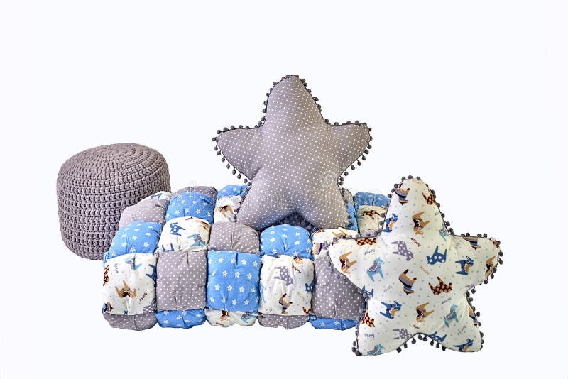 Two Five-pointed Star Shaped Pillows, Patchwork Comforter and Knitted Padded Stool on White ...