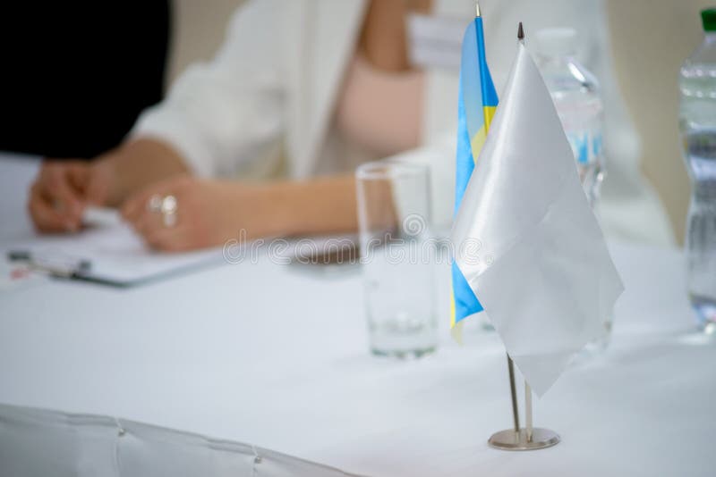 Two Flags on the Table. Indoor Business Conference Stock Image - Image ...