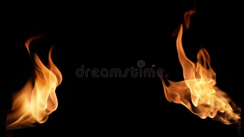 Two Flames of Fire Blaze from Different Sides of Screen in Dark. Real ...