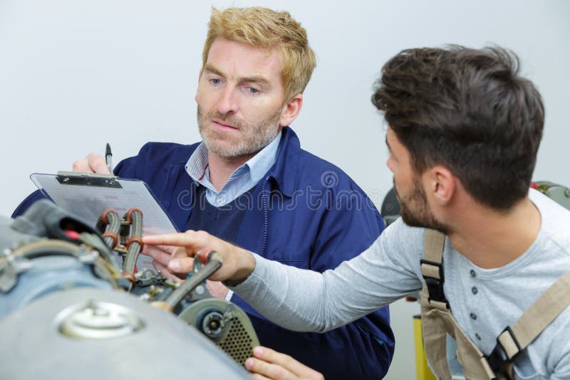 Two Flight Engineers Working on Airplane Stock Photo - Image of flight ...