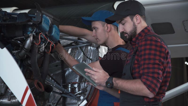 Flight Mechanics is Performing Pre-flight Inspection or Maintenance on ...