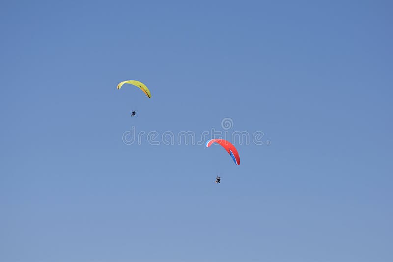 Two Flying Paragliders in the Blue Sky Stock Photo - Image of slip ...