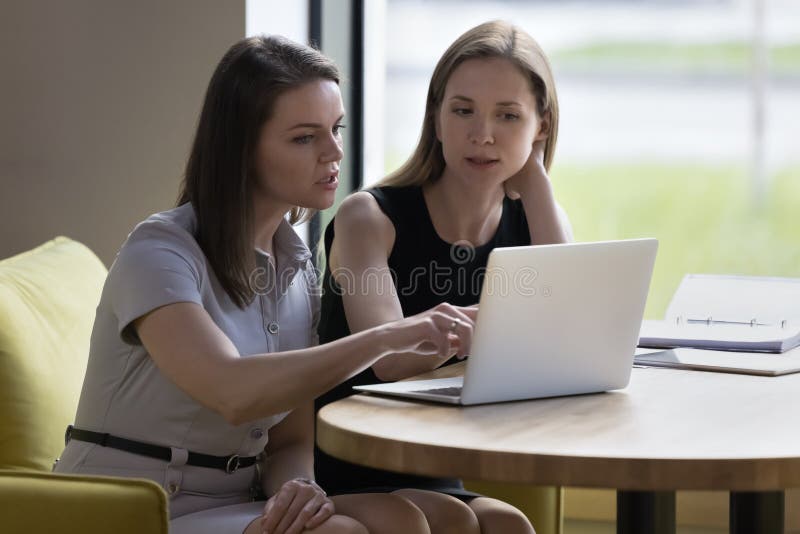 Two Businesswomen Learn Collaborative Task Looking at Laptop Screen ...
