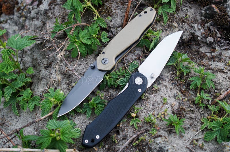 Two Folding Knives on the Ground Stock Photo - Image of metal, hunting ... Two Folding Knives on the Ground Stock Photo - Image of metal, hunting ...