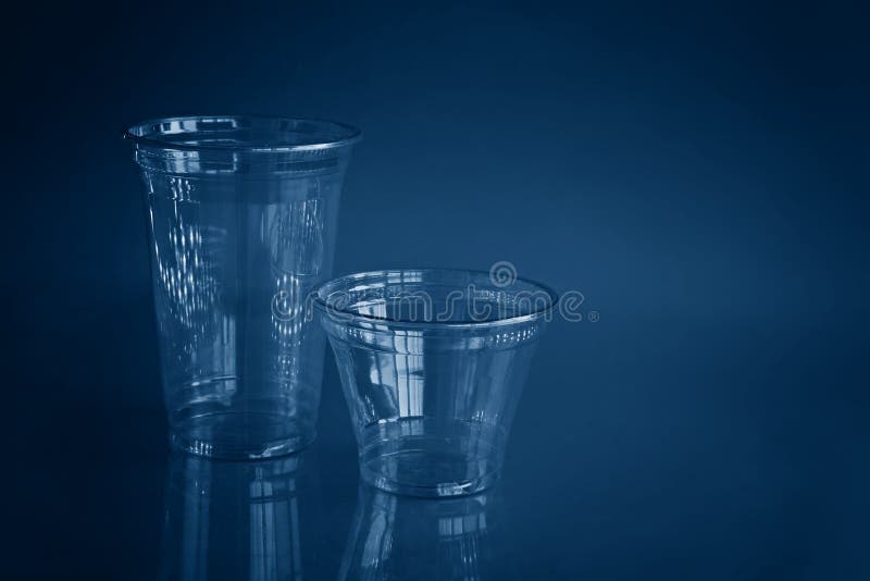 Two Transparent Plastic Cups in Blue Tones. Stock Image - Image of ...
