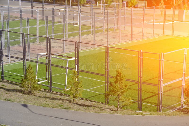 Two Football Fields with Freshly Laid Artificial Turf in the Sunlight ...
