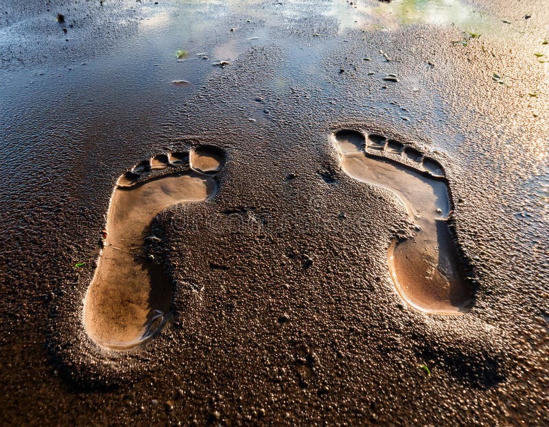 Two Footprints on Wet Earth after Rain, Symbolizing Traveling Side by ...