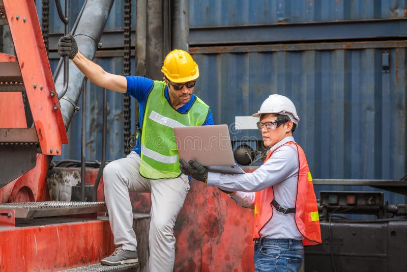 Foreman with Laptop Checking Position Loading Containers Box from Cargo ...