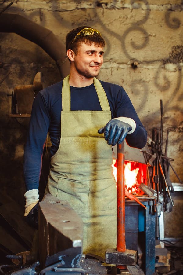 The Blacksmith is at the Forge Stock Photo - Image of senior, male ...