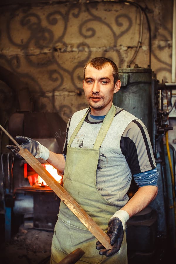 The Blacksmith is at the Forge Stock Photo - Image of farrier, glowing ...
