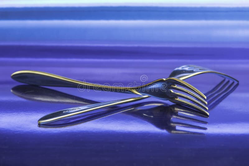 Two forks in the blue stock image. Image of curves, floating - 138278749