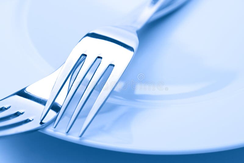 Two forks on a plate stock image. Image of serving, macro - 22158923