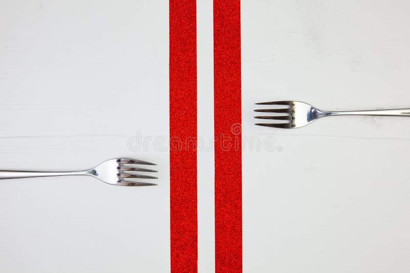 Two Forks and Red Ribbons on the White Table Stock Image - Image of ...