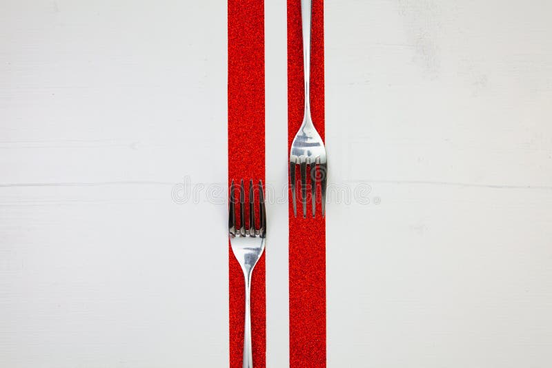 Two Forks and Red Ribbons on the White Table Stock Image - Image of ...