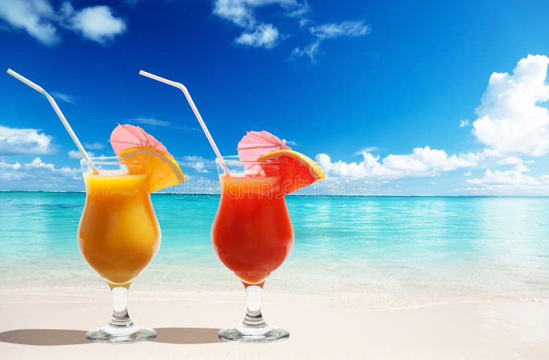 Two fresh juices on beach stock image. Image of grapefruit - 34697487