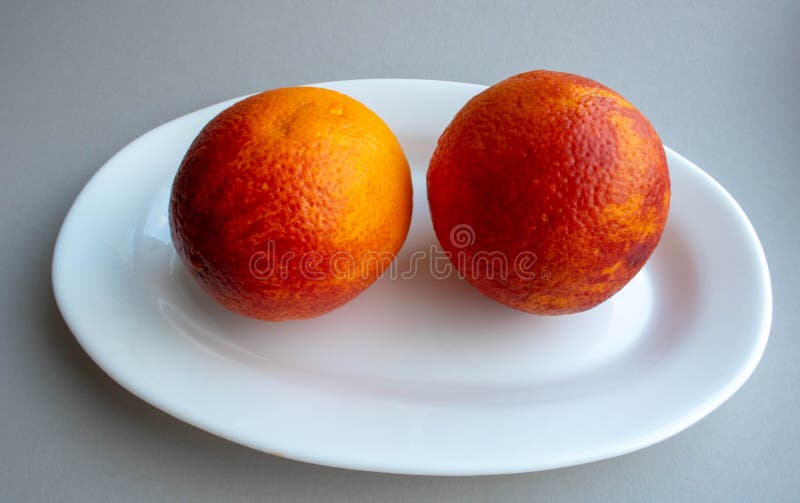 Two Fresh Oranges on a Ceramic Plate Stock Image - Image of orange ...