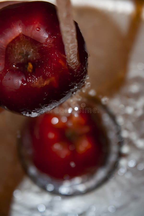 Two Fresh Red Apples Under Running Water. Apples with Drops of Water ...