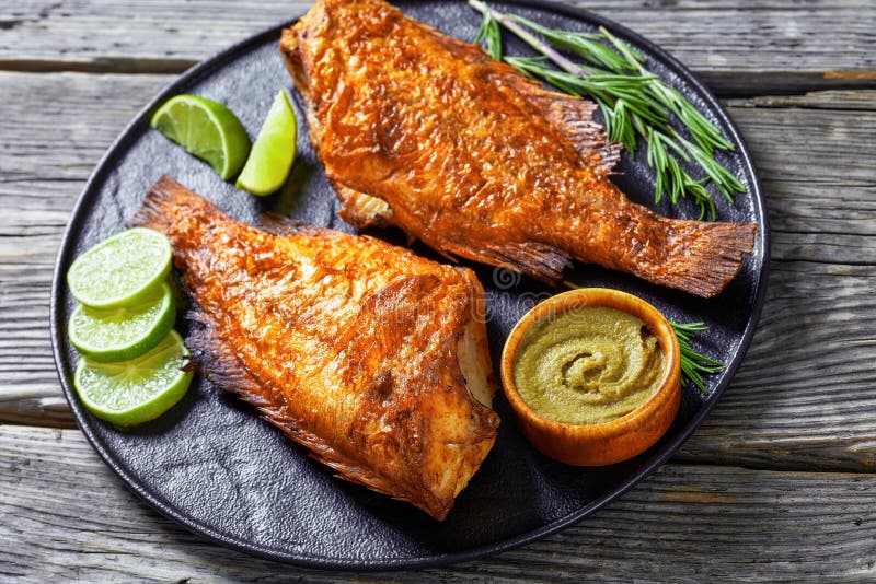 Two Fried Ocean Perch with Rosemary and Lime Stock Photo - Image of ...