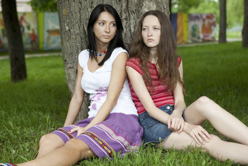 Two friend sitting at tree stock photo. Image of healthy - 14774982