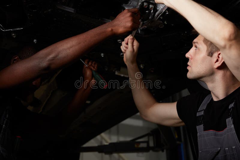 Two Friendly Professional Auto Mechanic during Work Stock Photo - Image ...
