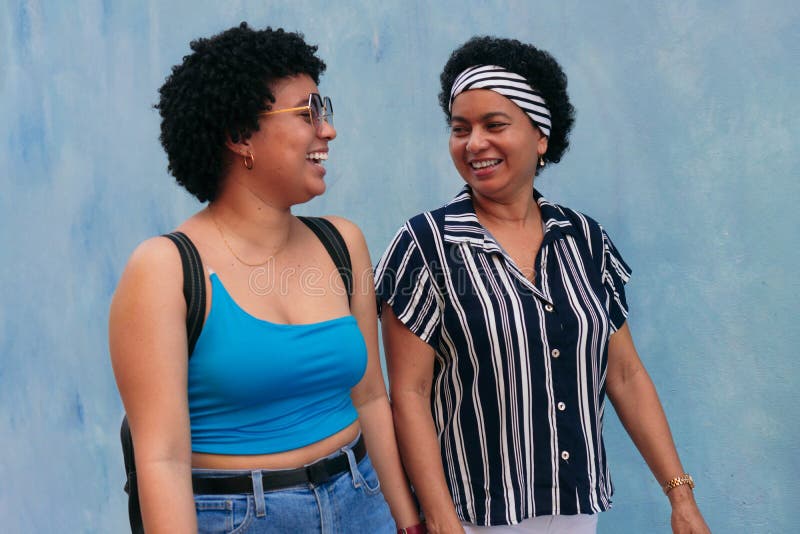 Two Friends with Afro Hairstyle Walking Down the Street Stock Photo ...