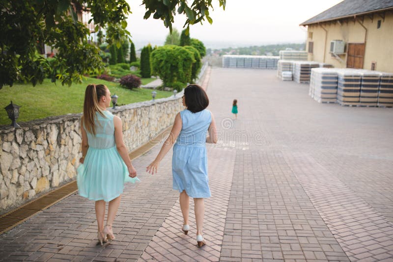 Two Friends and Child stock photo. Image of green, beauty - 84874776