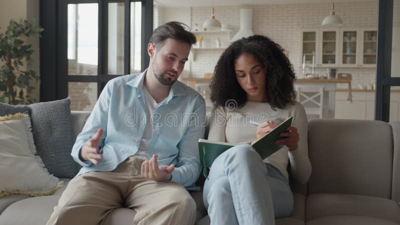 Two Friends Discussing Ideas, Taking Notes in Cozy Home Interior Stock ...