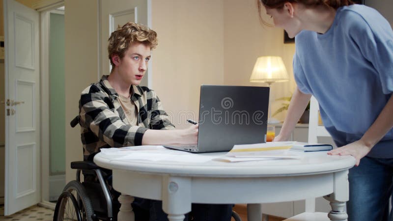 Two Friends are Discussing and Watching Something on the Computer ...